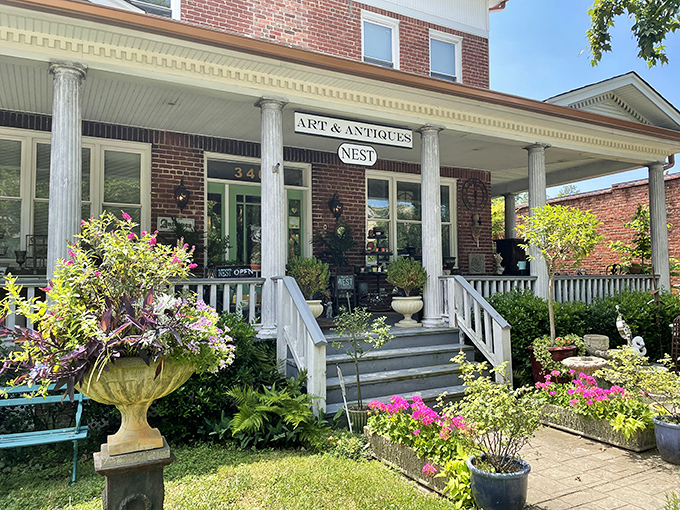 A gardener's paradise frames this elegant entrance. Even Martha Stewart would take notes on this perfect porch styling.