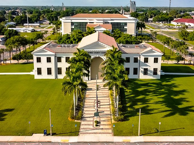 The Okeechobee County Courthouse complex spreads majestically across manicured lawns, a centerpiece of this budget-friendly community.