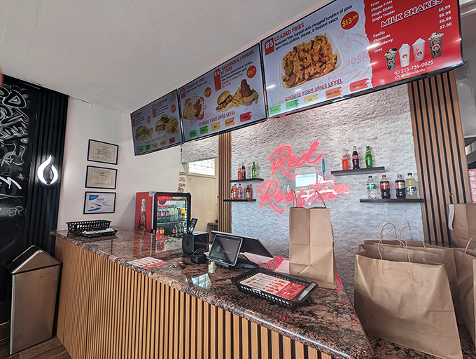 Behind that sleek counter lies Red Rooster's secret arsenal of spices. Their hot chicken transforms ordinary days into extraordinary memories.