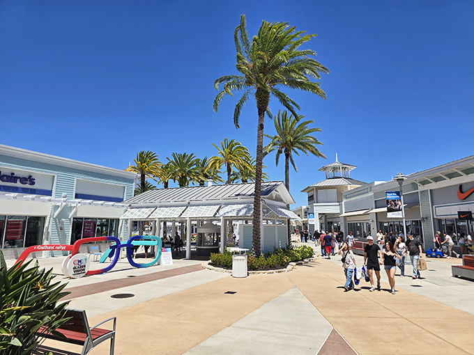 Those pastel buildings could double as a movie set for "Pretty Woman Goes Outlet Shopping."