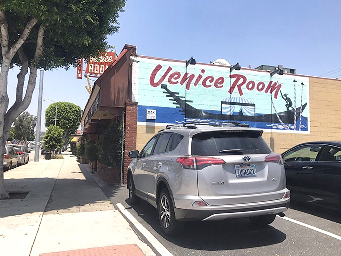 The Venice Room's vintage sign and brick facade hint at the grill-your-own adventure waiting inside.