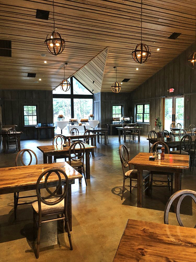 High ceilings, wooden beams, and globe pendant lights create an atmosphere that whispers "wilderness luxury." Hemingway would approve of this hunting lodge elegance.