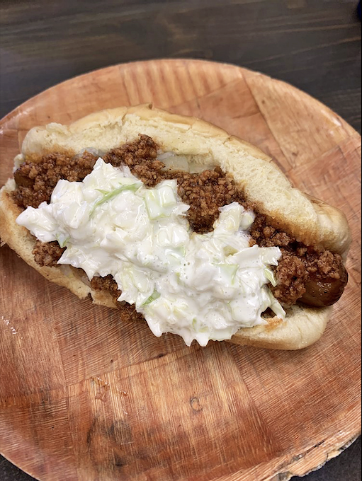 Behold the legendary West Virginia Dog in all its glory &ndash; meat sauce, coleslaw, and mustard creating a harmony that Mozart would envy.