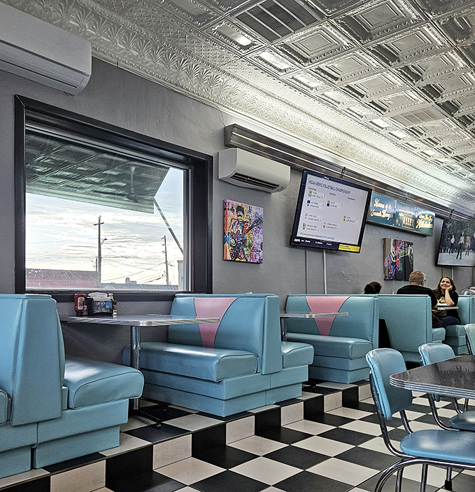 The booths aren't just seating; they're front-row tickets to the greatest show on earth: authentic American diner culture.