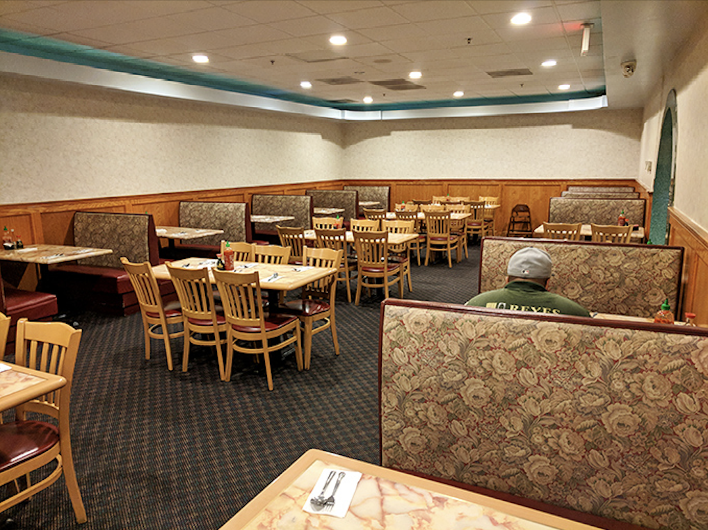 Cozy booths and simple wooden chairs create an unpretentious dining room where the focus stays squarely where it belongs&mdash;on your heaping plate.