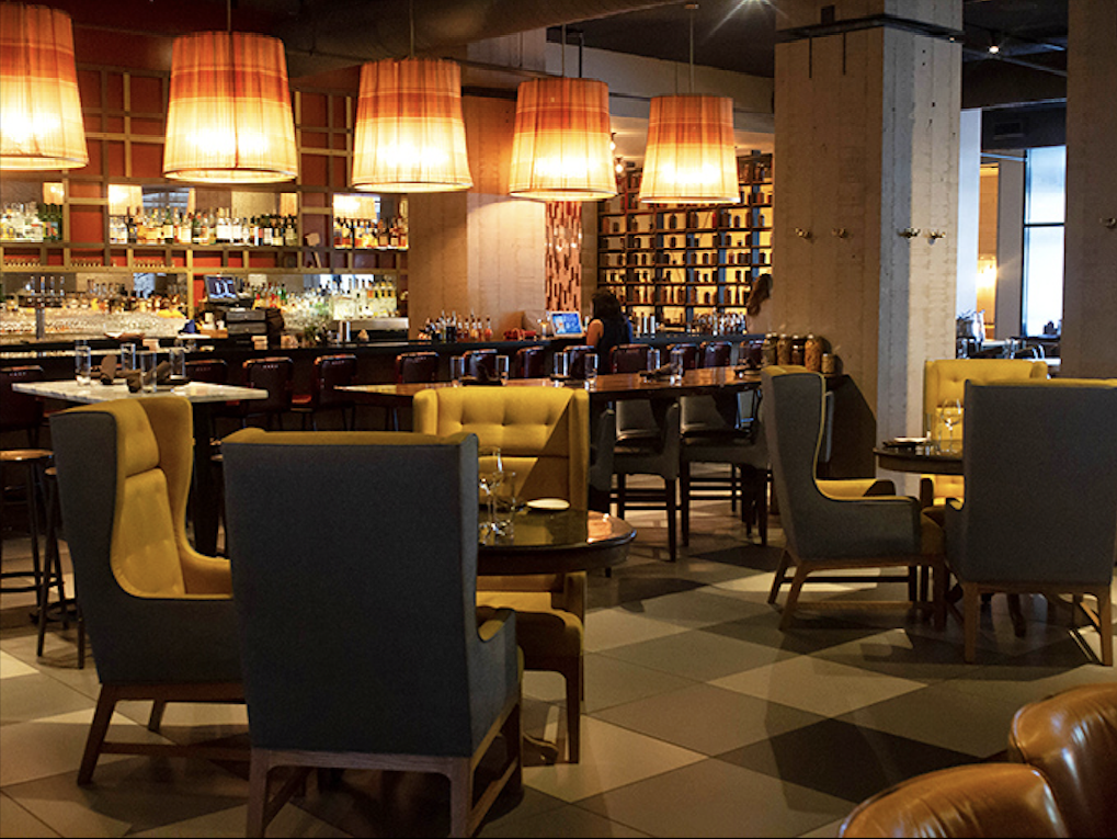 Step inside and discover a perfect marriage of contemporary design and classic steakhouse comfort&mdash;those mustard chairs aren't just stylish, they're beckoning you.