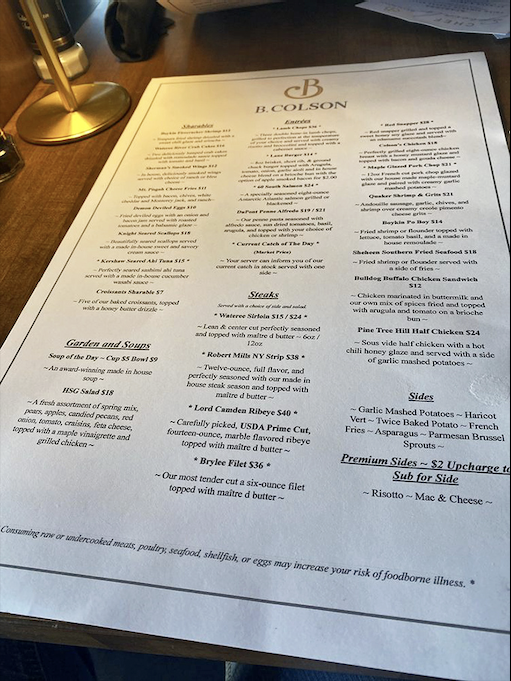 The menu reads like a love letter to Southern cuisine, with that legendary HSG Salad holding court among impressive steak and seafood offerings.