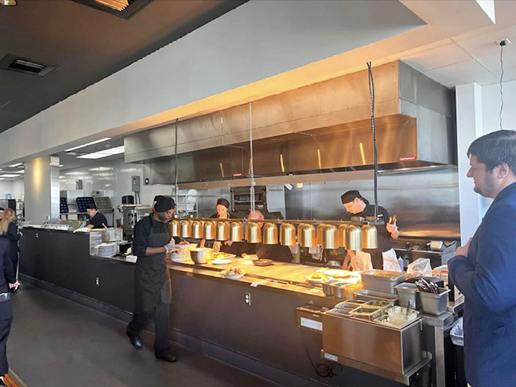 In the open kitchen, chefs work their magic with precision and passion, transforming raw ingredients into dishes worth writing home about.