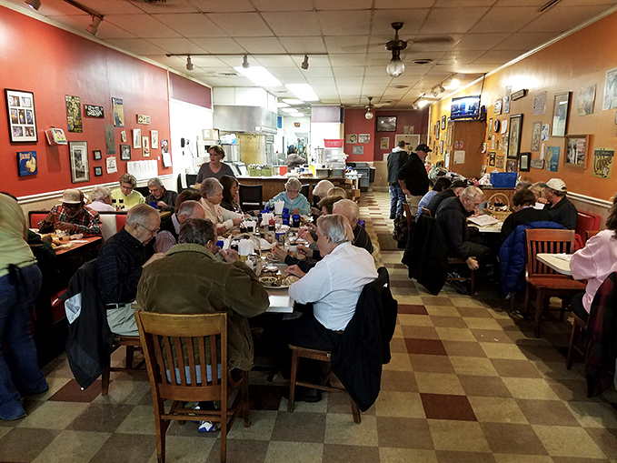 The bustling dining room hums with conversation and satisfaction, a community gathering place where strangers become neighbors over plates of home-cooked goodness.