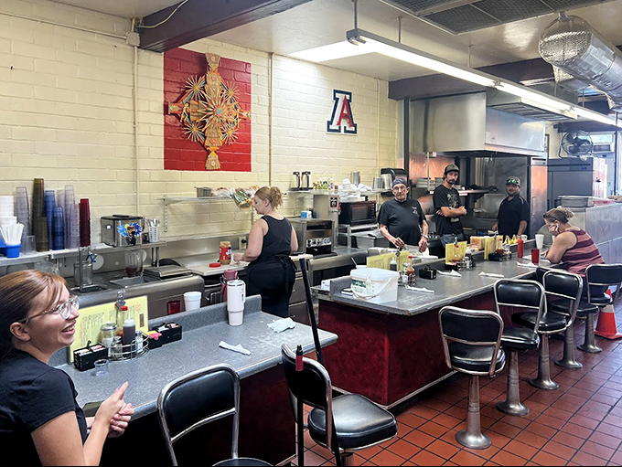 Counter culture at its finest! The classic diner setup invites solo diners to watch breakfast ballet unfold while University of Arizona pride decorates the walls.