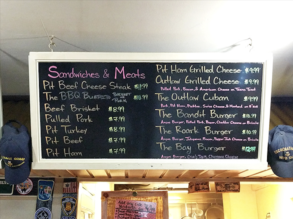 The chalkboard menu tells you everything you need to know&mdash;life's important decisions boil down to which smoked meat deserves your attention today.