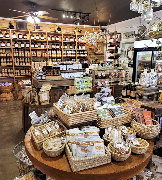 Wooden shelves lined with amber treasures create a flavor library that would make Willy Wonka trade his chocolate factory for a cider press.