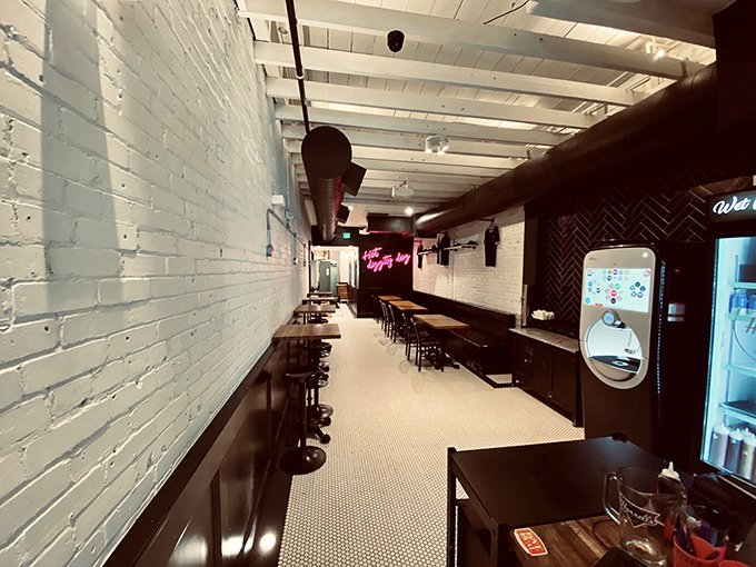 Minimalist cool meets comfort food at Harrell's interior. The pink neon "Hot diggity dog" sign isn't just decor&mdash;it's a prophecy of deliciousness to come.