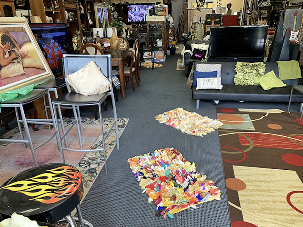 A treasure hunter's paradise where pathways wind through furniture islands, colorful rugs, and electronics&mdash;bring your compass and sense of adventure!