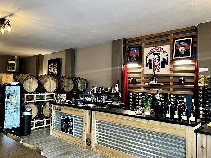 Industrial-modern tasting room showcases serious winemaking with barrel walls that whisper stories of patience.