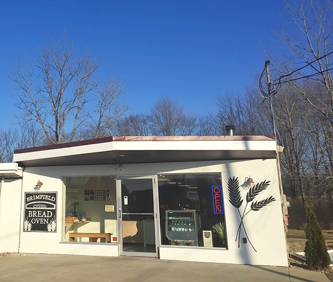 The unassuming exterior of Brimfield Bread Oven proves once again that culinary treasures often hide in plain sight. That neon "OPEN" sign is your gateway to carb paradise.