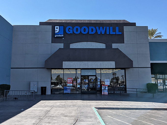 The modern facade of Goodwill on Rainbow Boulevard stands like a retail oasis in the desert, promising treasures within its air-conditioned walls.