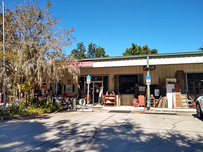 The unassuming exterior of Sugar Bear Antiques beckons treasure hunters with its casual display of furniture waiting to tell their stories.