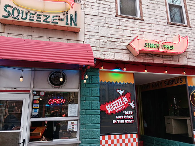 Not just a name &ndash; a literal instruction! The Squeeze-In's vintage storefront promises hot dog nirvana behind that unassuming facade.