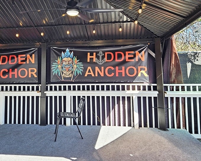 The entrance to Hidden Anchor welcomes you with tropical flair and a tiki-inspired sign that promises nautical adventures for your taste buds.