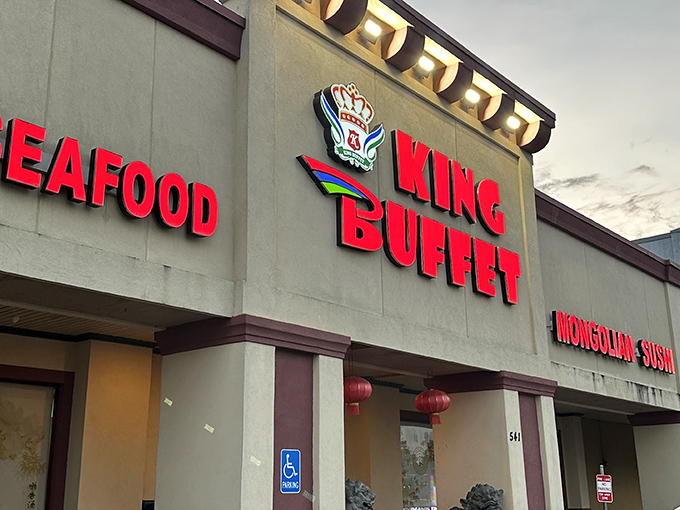The royal red signage beckons hungry travelers like a lighthouse for the famished. King Buffet's exterior promises seafood and Mongolian-sushi treasures within.