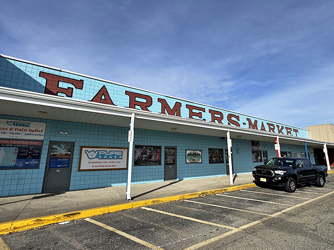 The iconic blue-tiled façade with bold red lettering stands like a beacon for bargain hunters. New Jersey's oldest and largest flea market promises treasures waiting to be discovered.