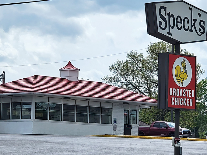 Speck's iconic red-striped roof and vintage sign stand as a beacon of comfort food in Collegeville, where time seems to slow down just enough to savor every bite.