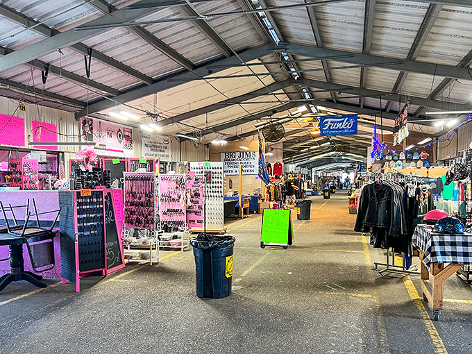 The indoor wonderland at Mobile Flea Market - where pink meets practicality and every aisle promises treasure hunting at its finest.