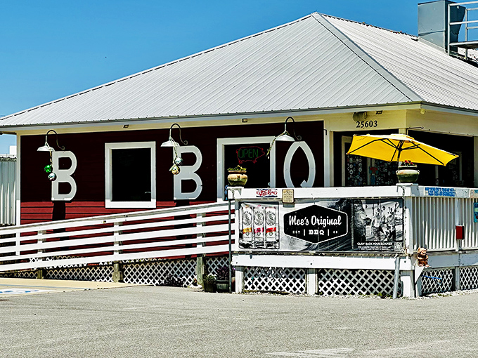 The red clapboard building with "BBQ" boldly displayed isn't trying to be subtle. Like a lighthouse for the hungry, it beckons from the Orange Beach shoreline.