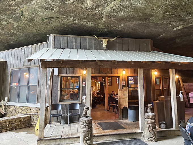 Who needs a conventional roof when Mother Nature provides a million-year-old rock ceiling? This rustic wooden entrance welcomes hungry adventurers to Alabama's most geological dining experience.
