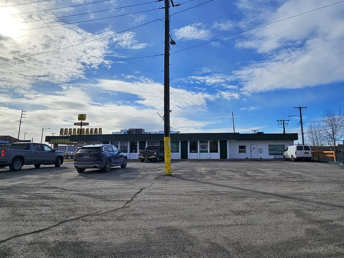 Lucky Wishbone's iconic sign stands like a beacon against the Alaskan sky, promising comfort food salvation to weary travelers.