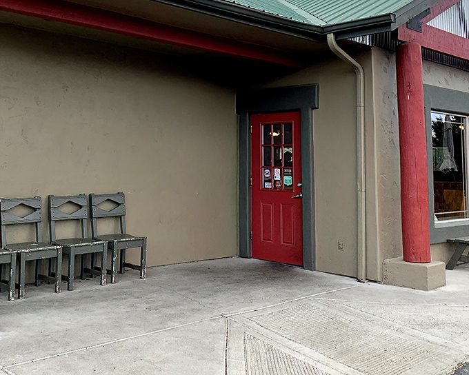 That red door isn't just an entrance&mdash;it's a portal to comfort food nirvana. The chairs outside suggest a place worth waiting for.
