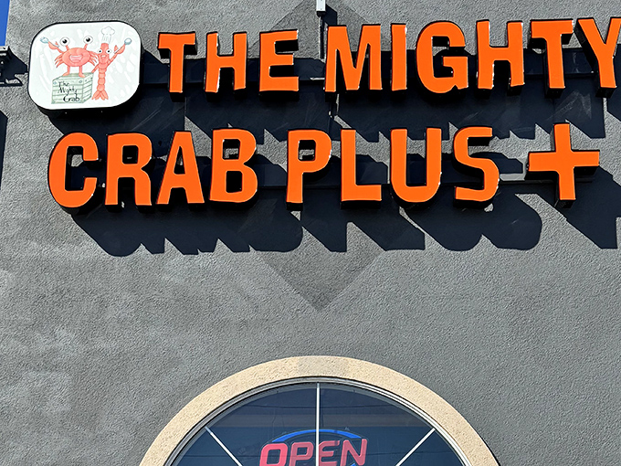 The bold orange signage of The Mighty Crab Plus+ announces itself with the subtlety of a foghorn, promising seafood treasures within this unassuming Benton establishment.