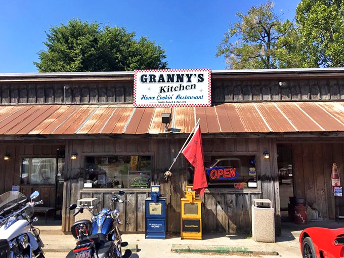 The rustic charm of Granny's Kitchen beckons from the roadside, its weathered tin roof and wooden exterior promising authentic Ozark comfort food within.
