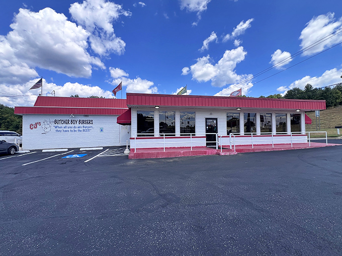 The classic American diner dream stands proudly against the Arkansas sky, promising burger perfection within its red-trimmed walls.