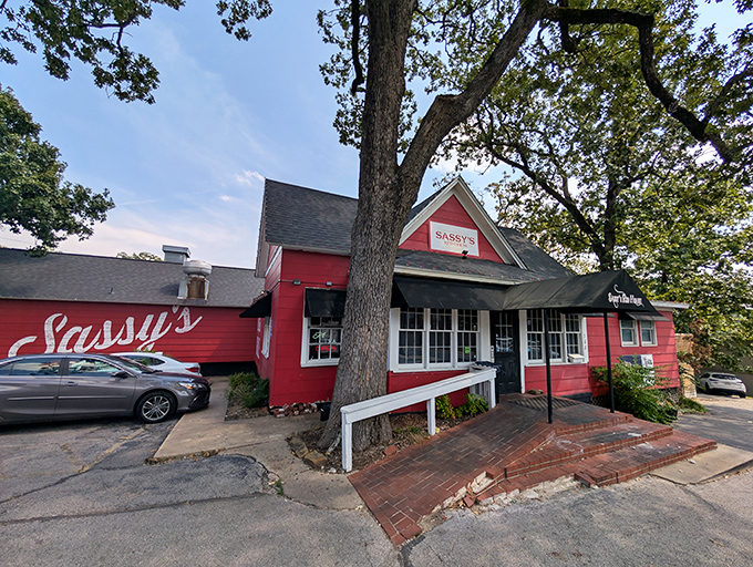 That iconic red exterior isn't just eye-catching—it's a beacon calling to barbecue pilgrims from across Arkansas like a smoke signal saying "come and get it!"
