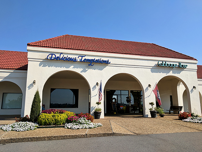 The Mediterranean-inspired facade of Delicious Temptations welcomes hungry travelers with colorful flower beds and the promise of breakfast bliss.