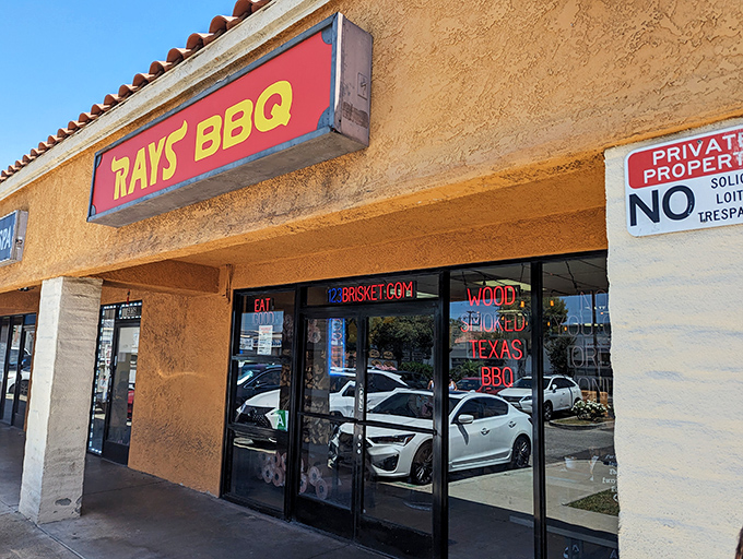 The unassuming storefront of Ray's BBQ might fool you, but that red sign is basically a smoke signal saying "barbecue paradise ahead.