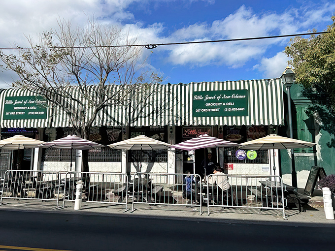 The iconic green and white striped awning of Little Jewel of New Orleans stands out in LA's Chinatown like a Mardi Gras float in a sea of dim sum.