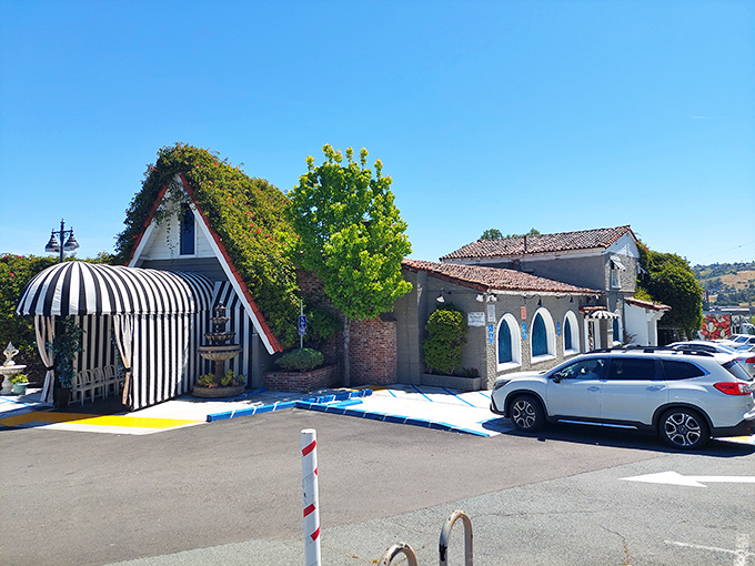 The A-frame entrance of The Dead Fish looks like a storybook cottage that somehow collided with a Mediterranean villa &ndash; architectural whimsy at its finest.