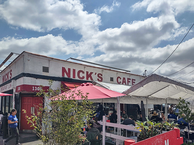 Nick's Café stands proudly against the LA sky, its red and white exterior promising breakfast dreams come true.