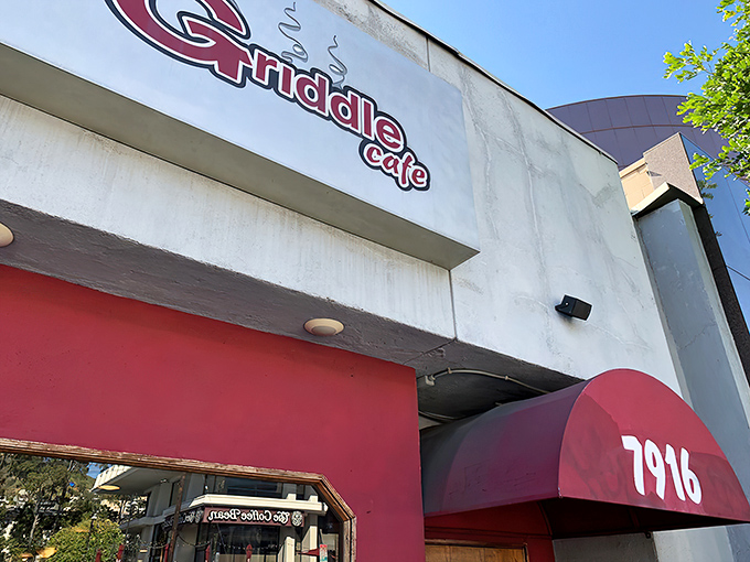 The iconic red and white facade of The Griddle Cafe stands like a beacon on Sunset Boulevard, promising pancake nirvana to those patient enough to wait.