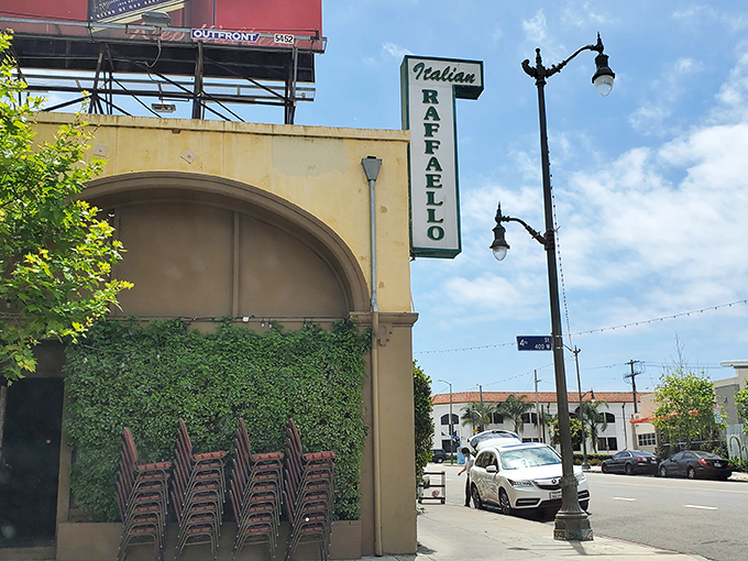 The unassuming facade of Raffaello Ristorante stands like a culinary sentinel on San Pedro's 6th Street, its vintage sign promising Italian treasures within.