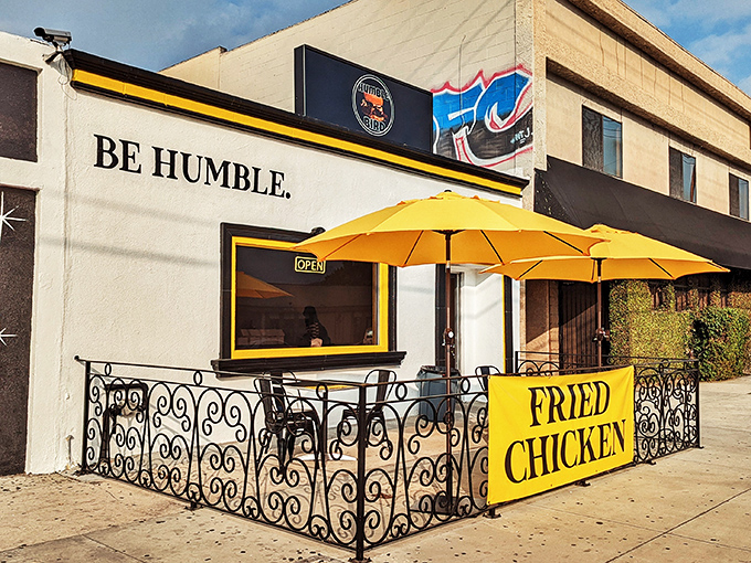 The bright yellow umbrellas and bold "BE HUMBLE" signage aren't just eye-catching—they're your beacon to Nashville-style chicken nirvana in North Hollywood.