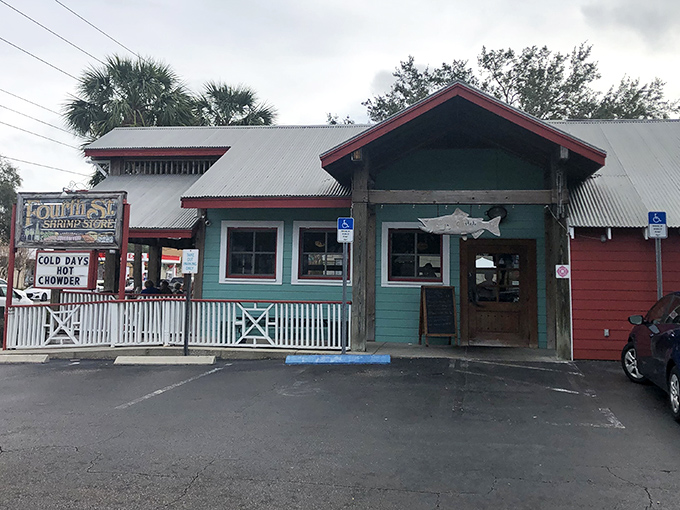 The mint-green facade with its distinctive red roof beckons like a friendly lighthouse for the seafood-starved. Florida architecture that says "come on in, the grouper's fine!"