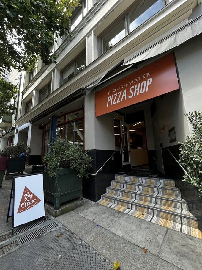 That welcoming orange awning beckons like a lighthouse for hungry souls navigating San Francisco's Mission District streets.
