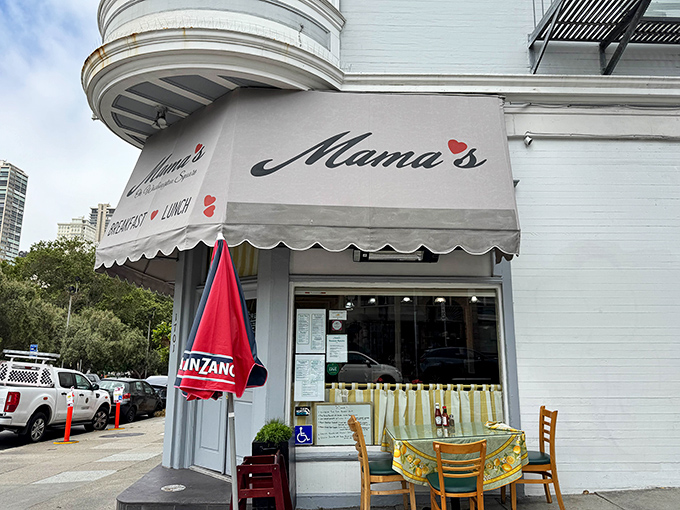 The iconic corner storefront of Mama's, where that signature white awning has beckoned breakfast pilgrims for generations.