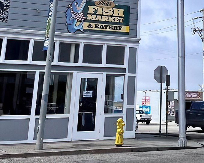 The unassuming exterior of Phil's Fish Market & Eatery belies the seafood treasures within. That cheerful blue fish sign has become a beacon for hungry travelers.