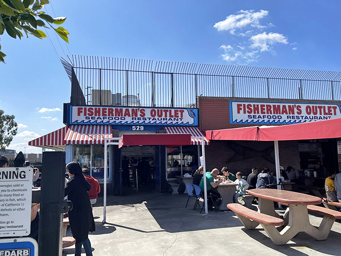 That classic red-and-white striped awning isn't just charming&mdash;it's a beacon calling seafood lovers from miles around.
