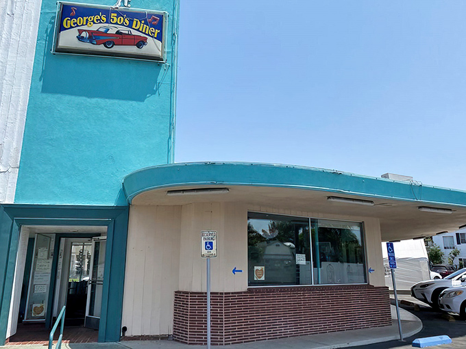 The turquoise facade of George's 50's Diner glows in the California sunshine, a retro oasis promising comfort food and nostalgia in equal measure.